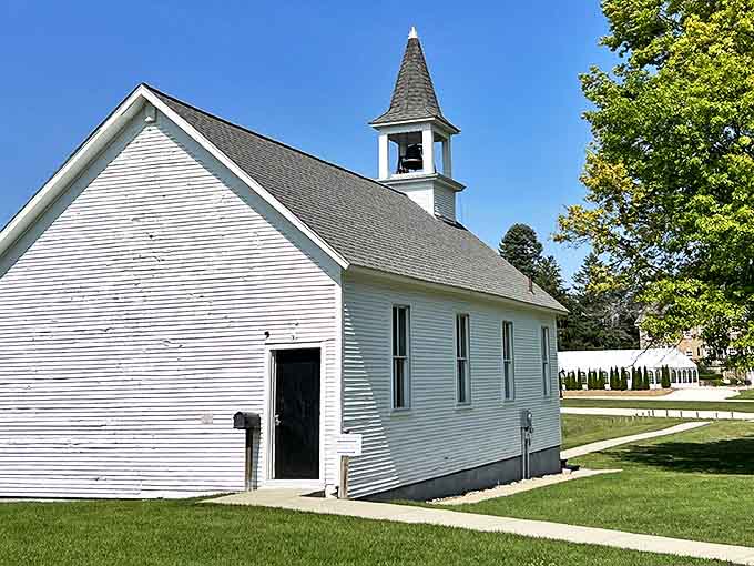 Simple white sanctuary offers spiritual respite amid historical grandeur. Its clean lines and modest steeple speak to faith's quiet persistence through changing times.