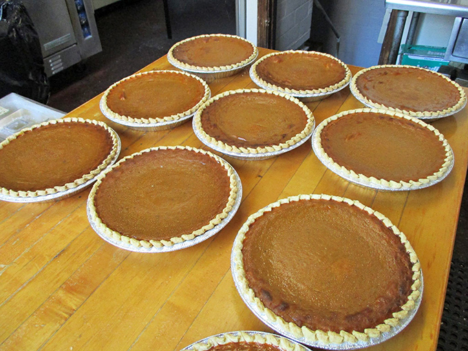 Freshly baked pies cooling in formation &ndash; the kitchen's edible artwork awaiting their moment of glory at your table.