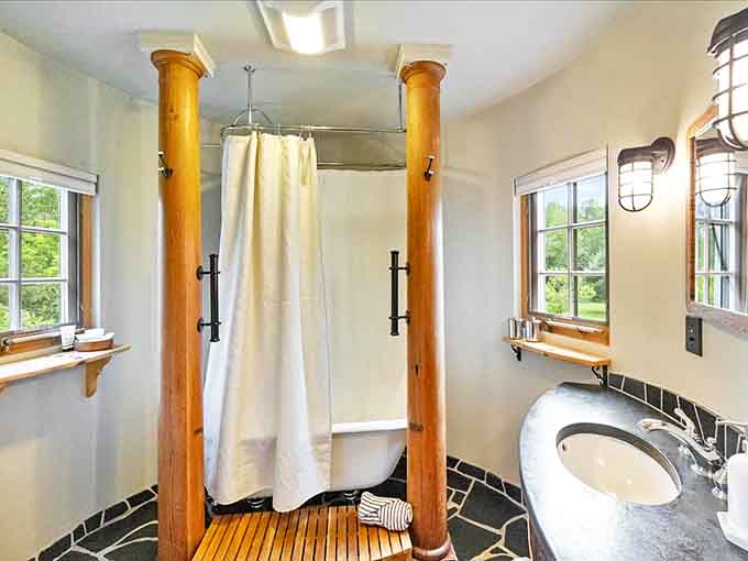This isn't just a bathroom – it's a spa-like retreat where wooden columns frame the tub and every detail invites you to linger longer.