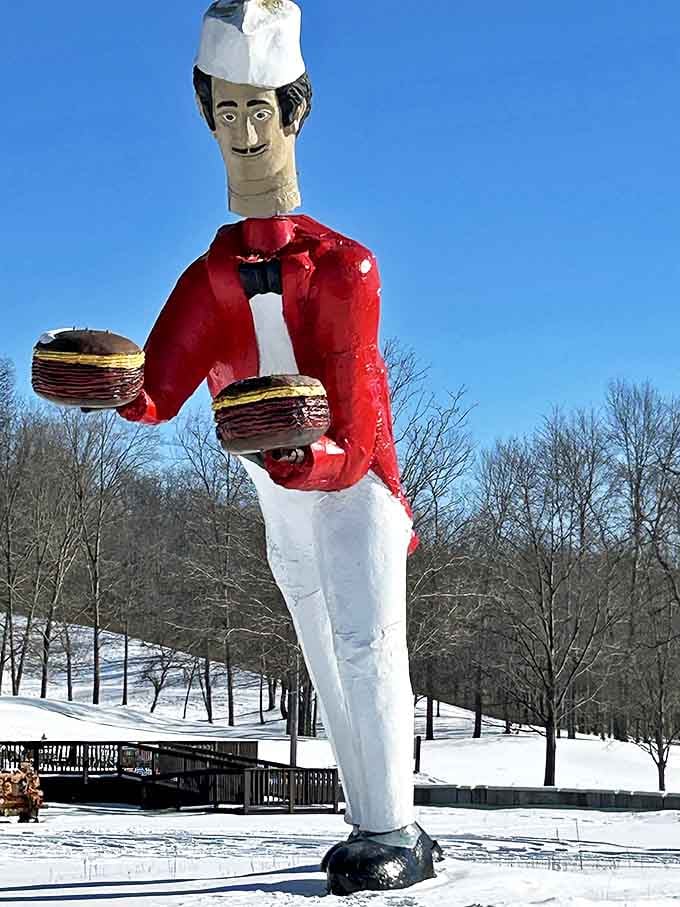 This towering chef statue stands as the unofficial greeter, holding hamburgers aloft like Olympic torches of deliciousness.