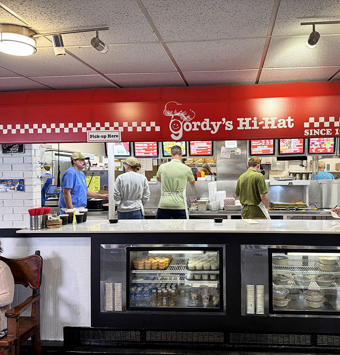 Behind this counter, the magic happens as skilled staff transform simple ingredients into meals worth driving hours to enjoy.