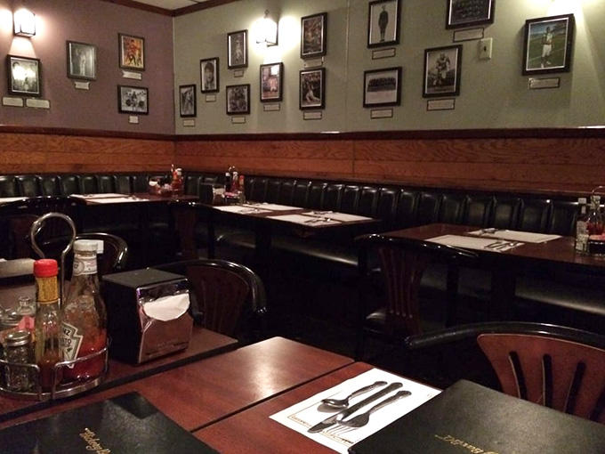 Cozy booths and warm lighting create the kind of atmosphere where strangers become friends over ribs.