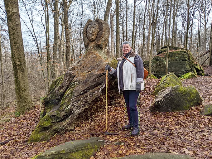 Scale and perspective: A visitor stands beside one of Stuart's impressive carvings, highlighting the massive canvas he chose.