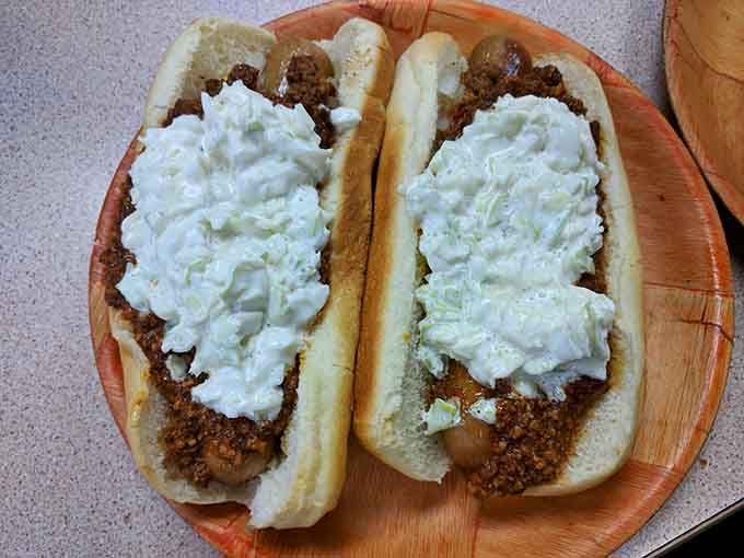 Two chili cheese dogs demonstrate that sometimes more is more, especially when it comes to melted cheese and homemade chili.