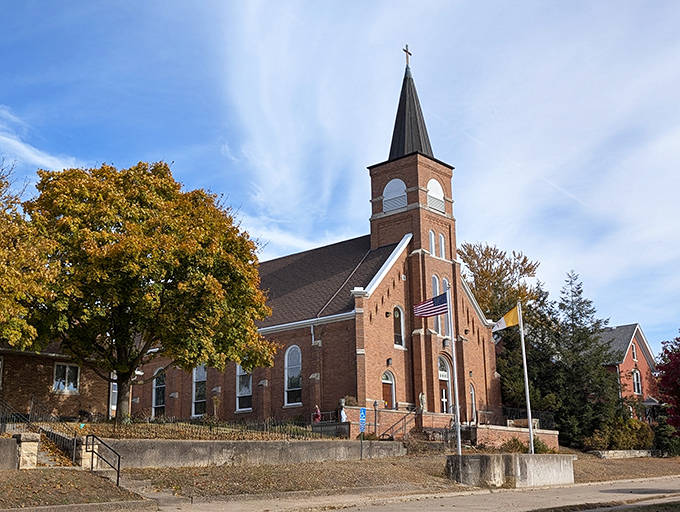 Immaculate Conception Catholic Church reaches skyward with architectural grace, its spire serving as both a physical landmark and spiritual beacon for generations.