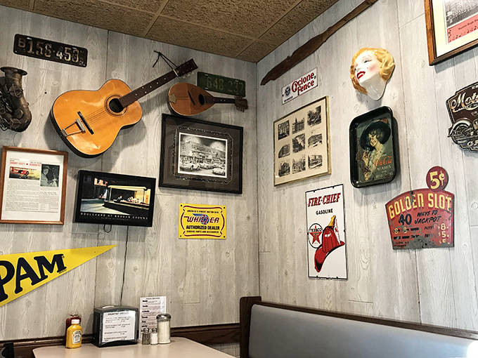 Guitars, vintage signs, and memorabilia create a museum of Americana that feels collected rather than curated over Kenny's long history.