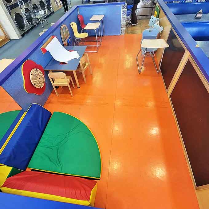 The children's play area proves someone finally understood that kids plus laundry usually equals parental meltdown.