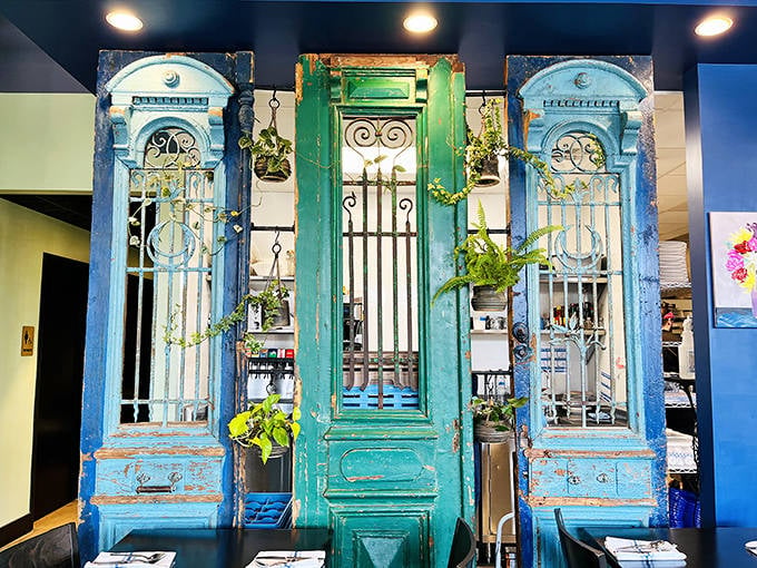 Those weathered blue and green doors with ornate ironwork aren't just d&eacute;cor &ndash; they're authentic pieces of New Orleans, transplanted to the Midwest.