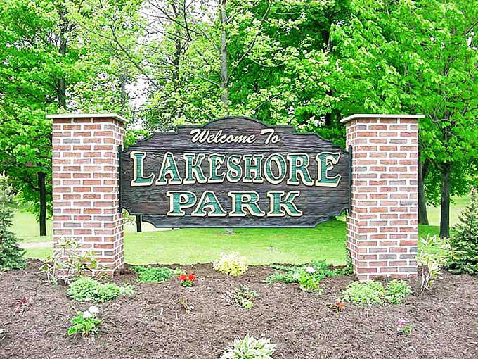Lakeshore Park welcomes visitors with classic brick pillars and friendly signage. Gateway to lakeside relaxation and family memories in the making.