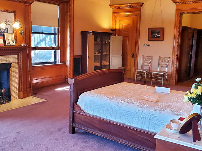 A "modest" sleeping chamber larger than most modern apartments. The bed stands so high you'd need mountaineering equipment to climb in.