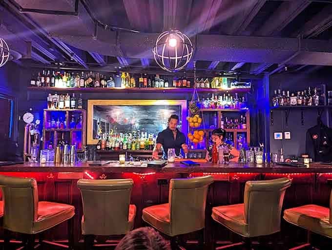Bartenders orchestrate experiences from behind the substantial wooden bar, each movement as precise as a surgeon's and as fluid as a dancer's.