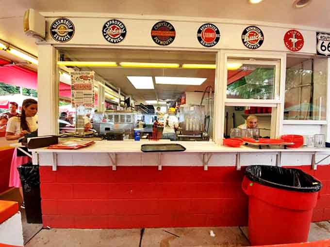 The ordering window, with its menu board proudly displayed, stands ready to transform hungry visitors into satisfied regulars with each perfectly prepared meal.