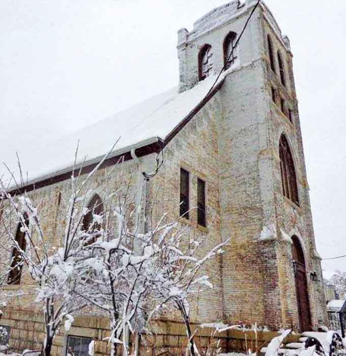 Even in winter's embrace, this stone sanctuary stands as a warm refuge against Minnesota's snow-covered landscape.