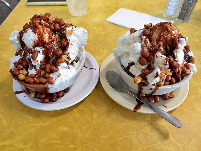Freshly roasted peanuts cascade over mountains of ice cream, creating that perfect sweet-salty symphony that makes your mouth applaud.