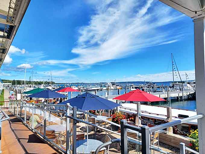 The Pier Restaurant's deck offers front-row seats to harbor life, where boats become moving scenery and every table feels like the best one.