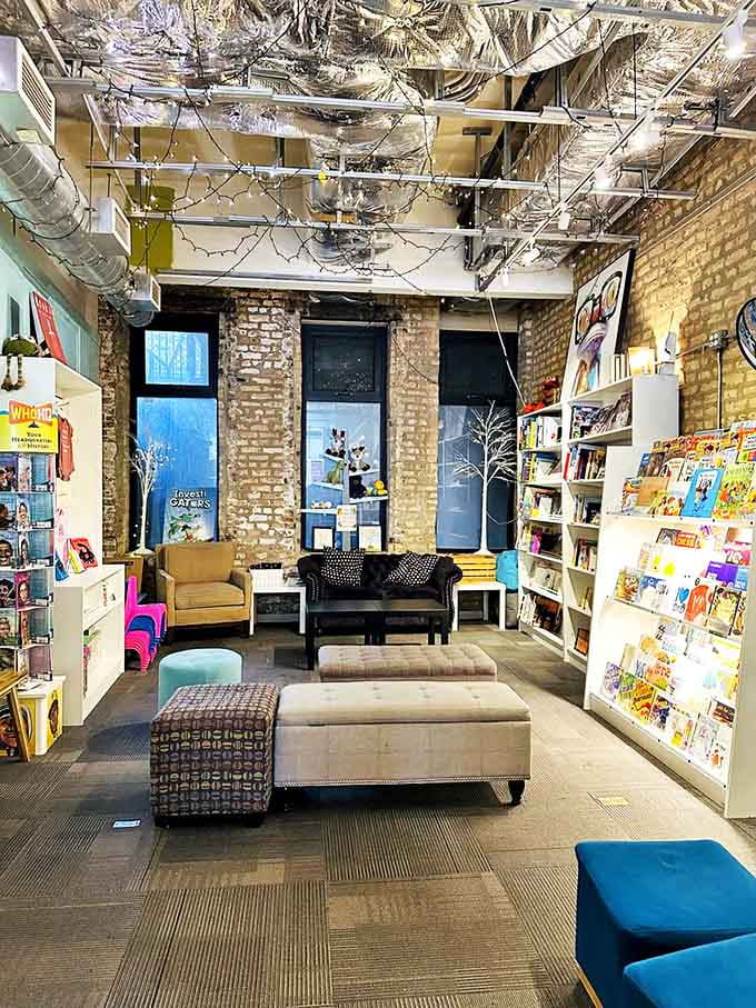 Cozy ottomans and armchairs create a living room atmosphere where strangers become temporary neighbors united by their love of good books.