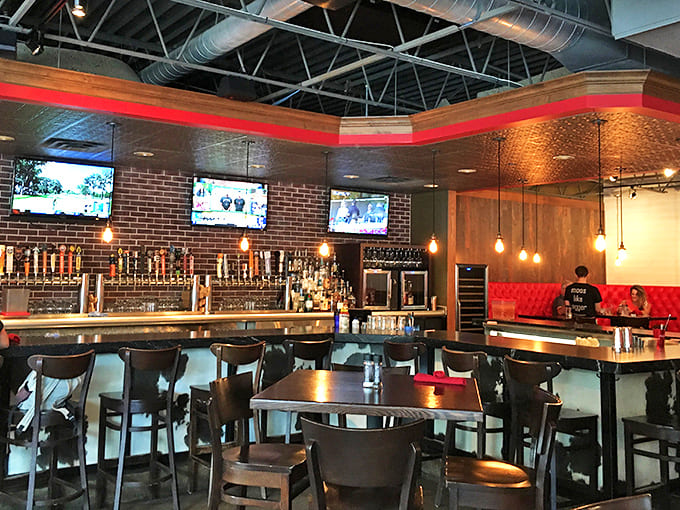 The bar beckons with gleaming taps and warm lighting, promising craft beer perfection to wash down those legendary cheese curds.