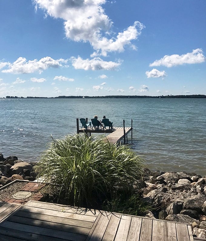 Peaceful dock with Adirondack chairs: Two chairs, endless water views – the perfect spot to remember what matters while the mainland's chaos fades away.