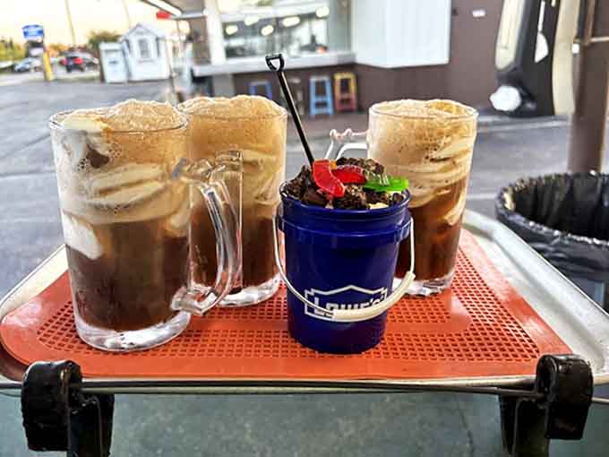 Root beer floats served in frosty mugs &ndash; watch as vanilla ice cream creates that magical creamy head that defines summer afternoons.