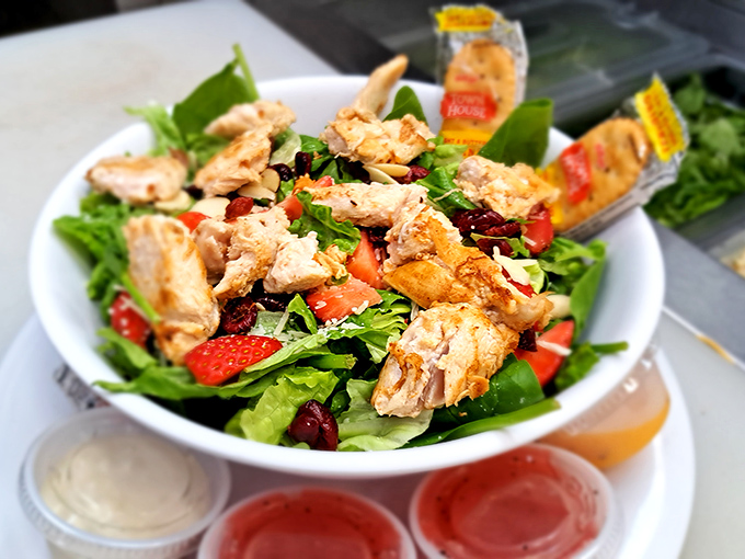 A salad that's actually exciting &ndash; fresh greens, grilled chicken, strawberries, and other goodies that make healthy eating feel like cheating.