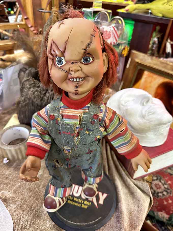 The Chucky doll sits among other collectibles, reminding visitors that horror movie memorabilia has become legitimate vintage material worth preserving and displaying.