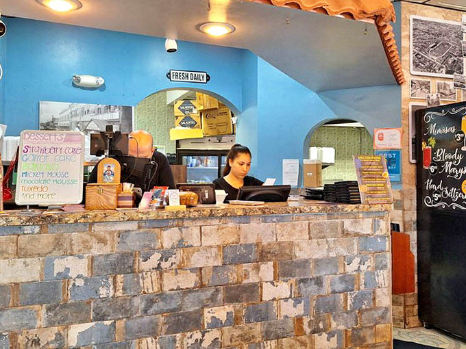 Behind this rustic counter, culinary magic happens – where orders are taken with a smile and Greek traditions are honored.