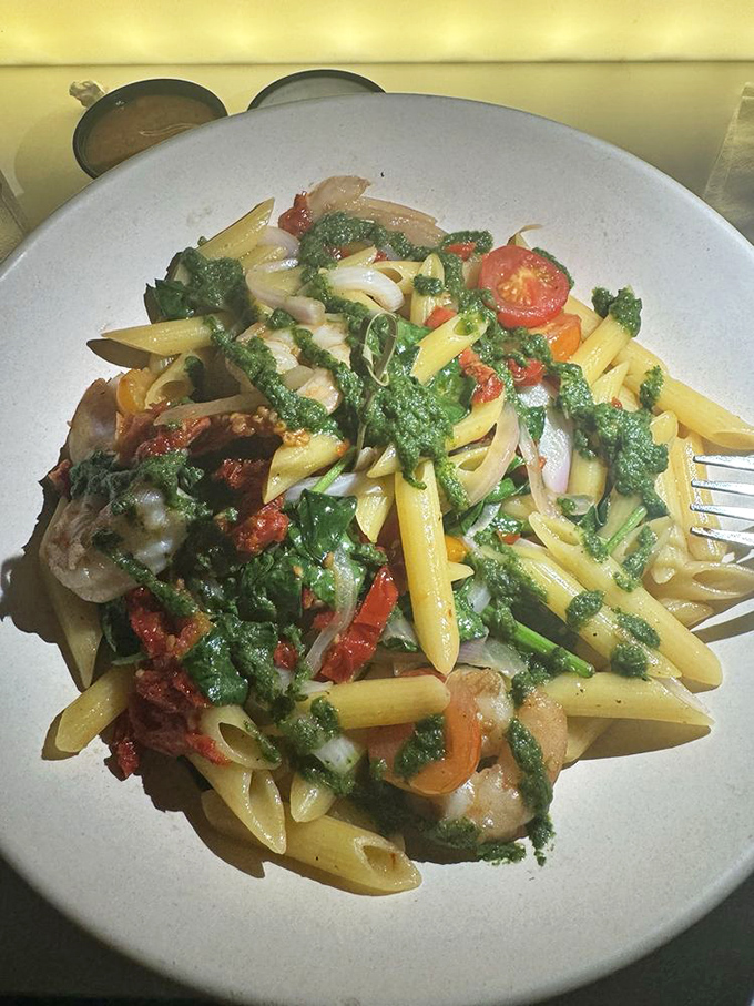 Penne pasta gets dressed up with pesto and grilled chicken, showing that even theme restaurants can handle Italian food without apology.