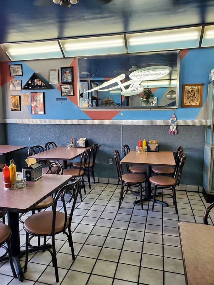 The dining room channels classic diner vibes with a sci-fi twist, where spaceships hang overhead and everyone's welcome.