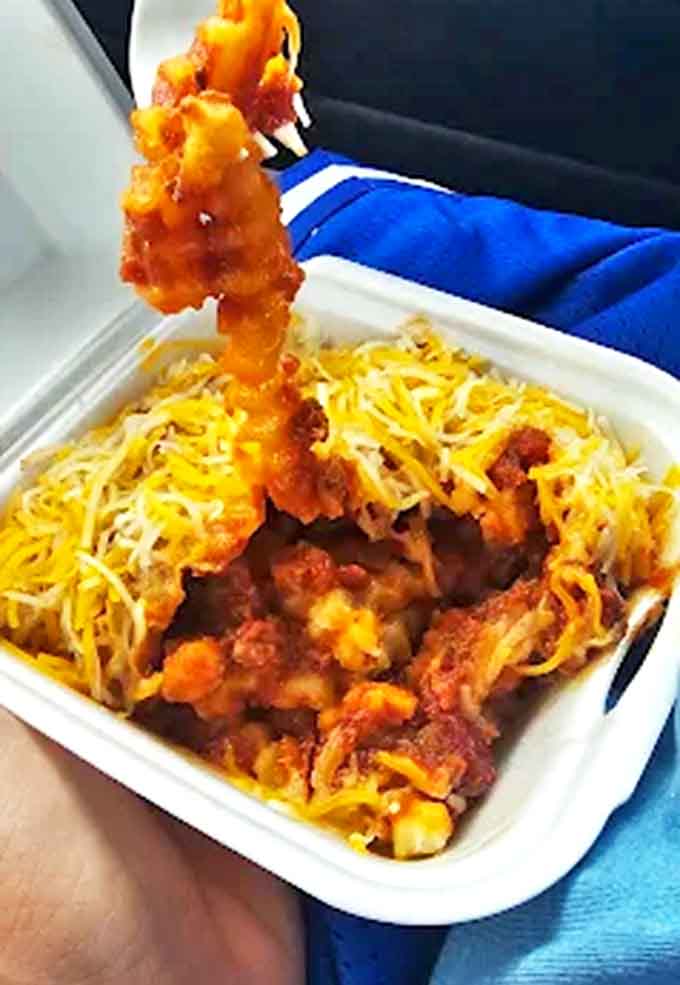 Chili cheese fries that require both a fork and a moment of silent appreciation &ndash; layers of savory, cheesy goodness that comfort the soul.