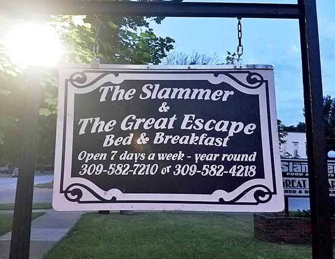 That vintage-style sign announces The Slammer's dual identity as both historical landmark and welcoming bed and breakfast open year-round for adventurous guests.