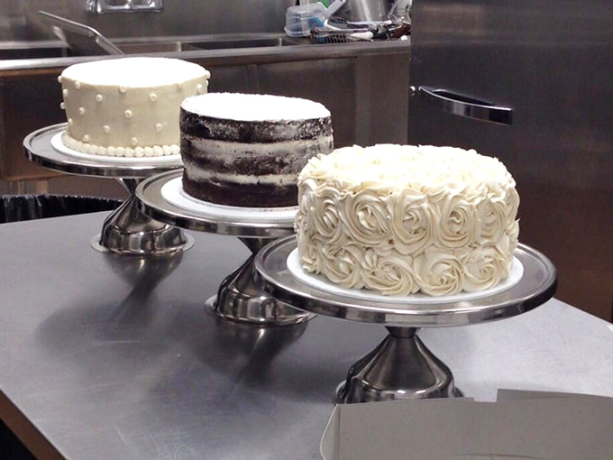 Layer cakes standing proud on pedestals like the edible royalty they truly are, waiting for their moment.