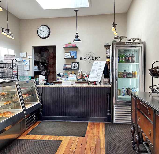 The counter area balances rustic charm with professional efficiency, where pastry dreams come true one transaction at a time.
