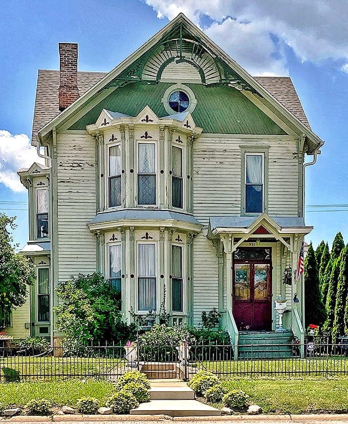 Victorian homes stand like architectural dowagers, their gingerbread trim and bay windows refusing to surrender to modern minimalism.