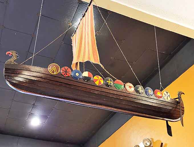 A Viking longship suspended from the ceiling proves when you commit to a theme, you go all in, nautical style.