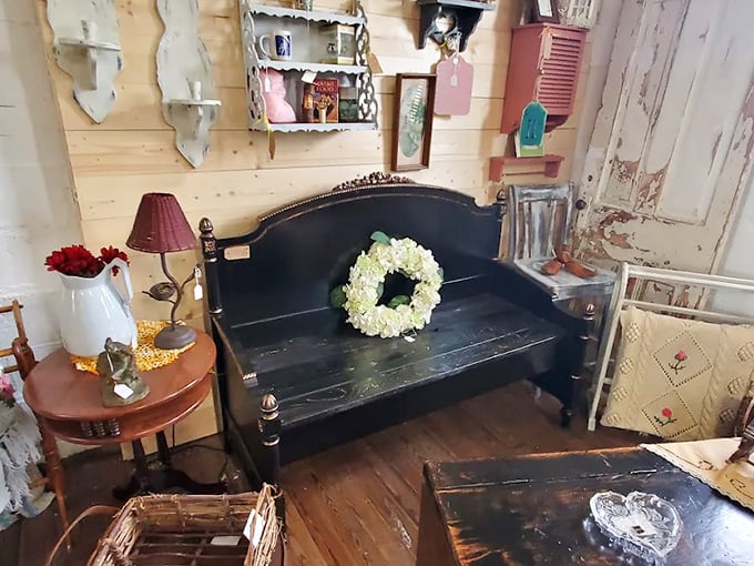 This vintage bench has seen some things and lived to tell about it, with its worn black paint and classic lines proving that good design never really goes out of style.