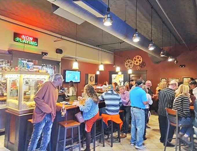 The bar area buzzes with energy as patrons gather before shows, creating the community atmosphere that makes the Riviera more than just a venue.