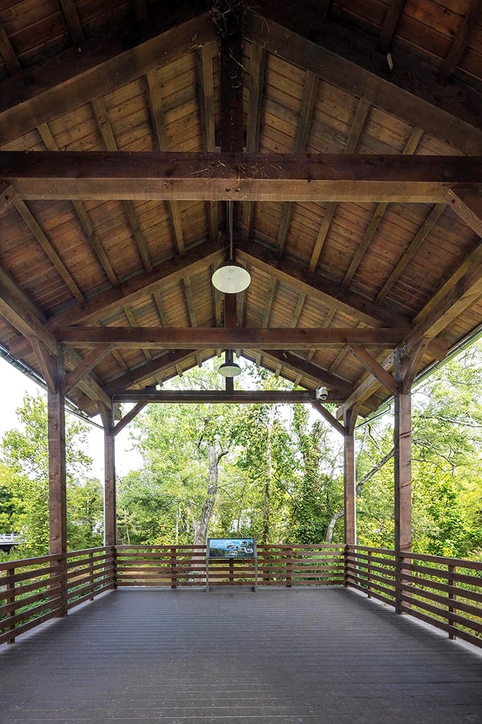 This simple entrance kiosk serves as a gateway to adventure, where two explorers begin their journey into natural wonders.