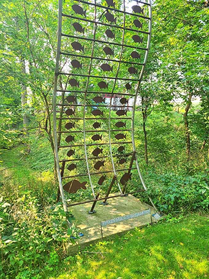 A metal fish display that proves even aquatic life looks cooler when rendered in steel and arranged like underwater architecture.
