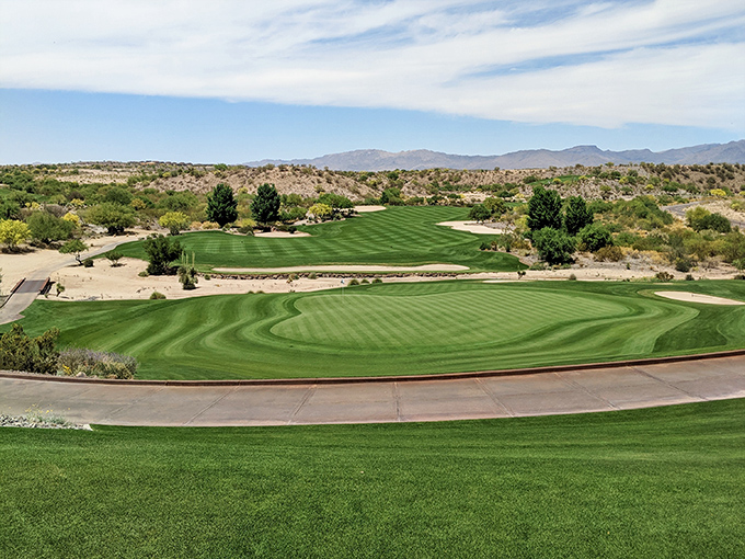 Wickenburg Ranch Golf Club showcases meticulously maintained fairways that create a striking contrast against the rugged desert backdrop.