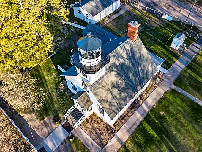 From above, the lighthouse's strategic position becomes clear, its location perfectly situated to guide ships through potentially treacherous waters.