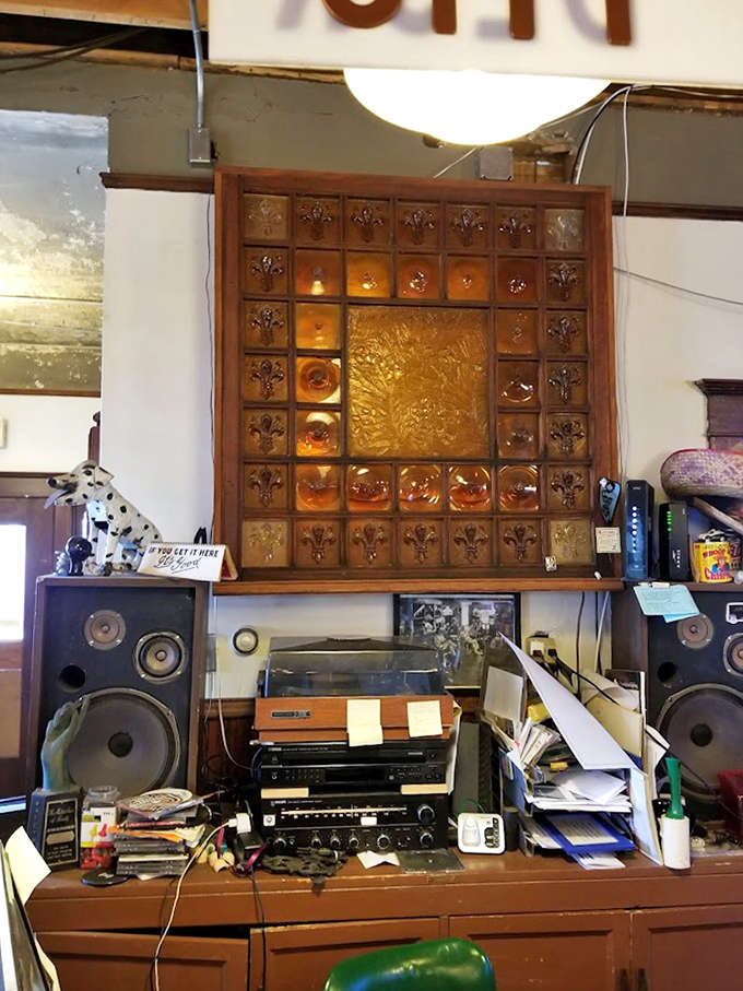 Vintage audio equipment and amber glass create a warm vignette that feels like stepping into your coolest grandfather's perfectly preserved den from 1975.
