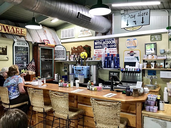 The bar area offers a welcoming spot to enjoy local brews and creative cocktails while soaking in the restaurant's authentic Florida atmosphere.