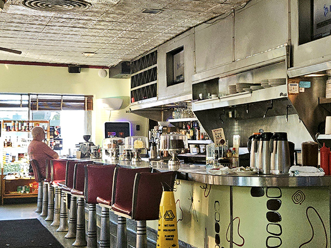 The counter area invites solo diners to perch on red vinyl stools, watching skilled hands work breakfast magic while trading friendly banter with longtime staff.
