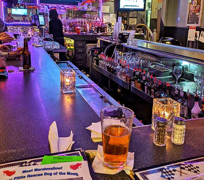 The bar isn't just where drinks are served &ndash; it's command central for race watching, story swapping, and the occasional "remember when" about legendary drivers.