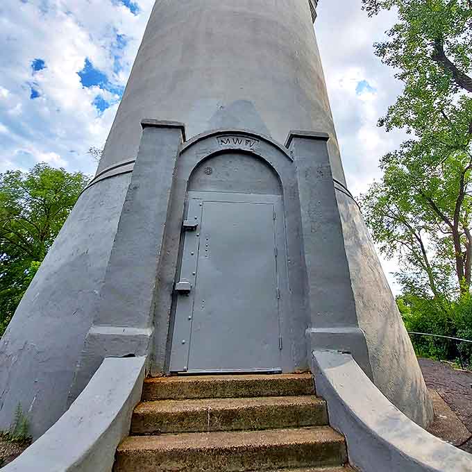 The tower's mysterious entrance beckons the curious, promising secrets and spectacular views for those lucky enough to enter.