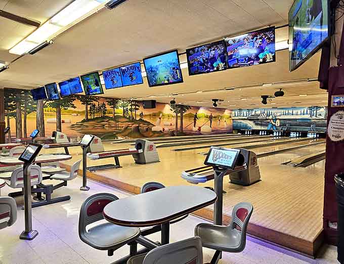 Beyond the dining room lies Woody's secret weapon &ndash; vintage bowling lanes where the satisfying crack of pins has soundtracked family fun for generations.