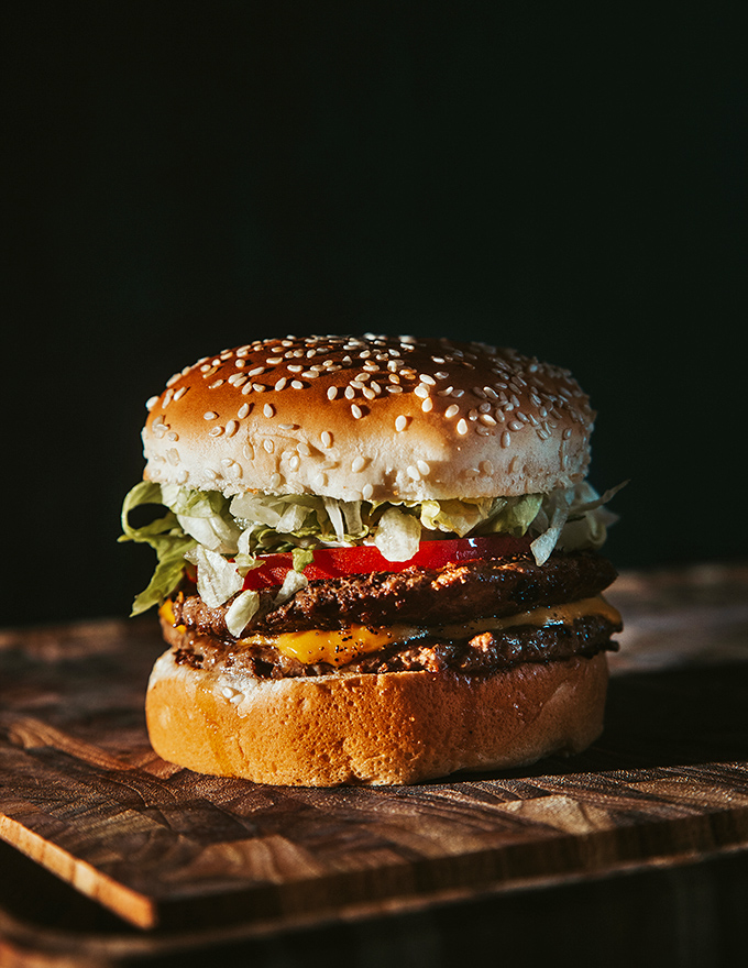This isn't just a burger – it's a perfectly balanced tower of beef, cheese, and fresh toppings that puts fancy gourmet versions to shame.