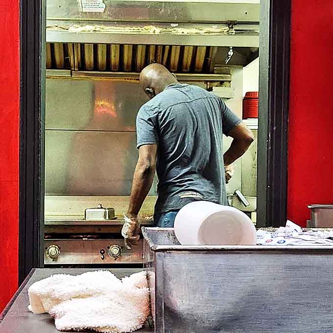 Behind the scenes magic: where patties meet griddle in a sizzling dance that's remained unchanged for decades.