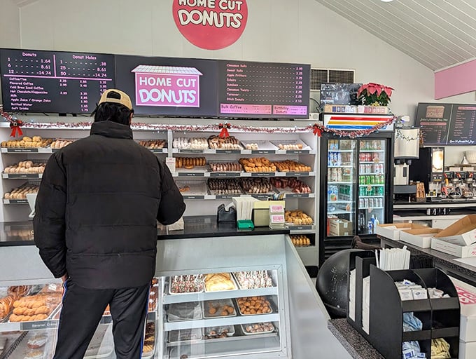 Counter: A customer contemplates life's most important decision while facing the Sistine Chapel of fried dough &ndash; what delicious path to choose?