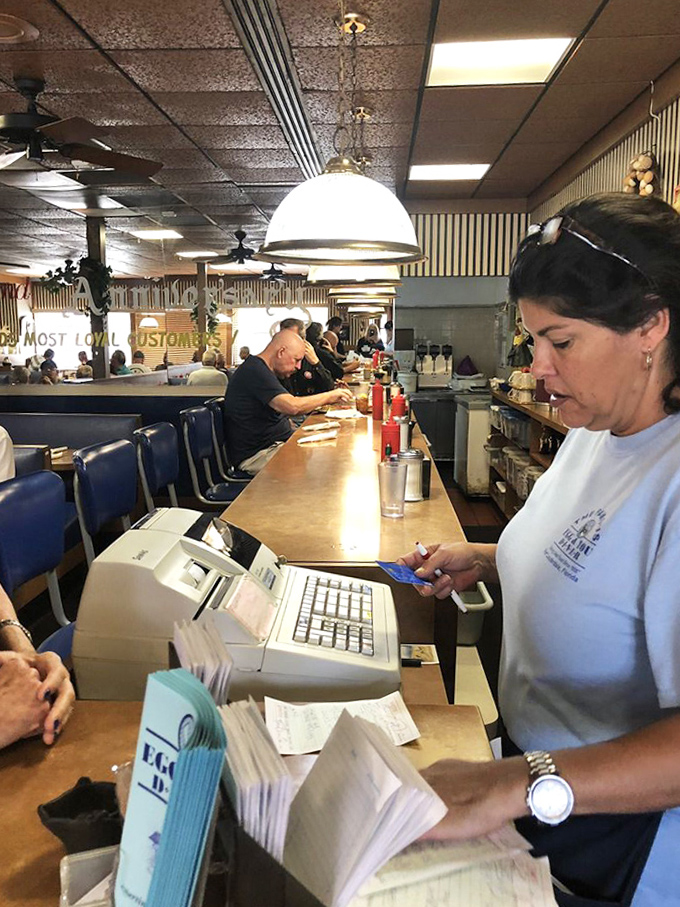 The counter seating offers front-row views of short-order cooking magic, where seasoned staff choreograph the breakfast rush with practiced precision.